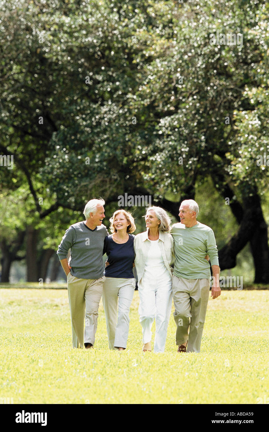 Smiling walking face to face arm around hi-res stock photography and ...