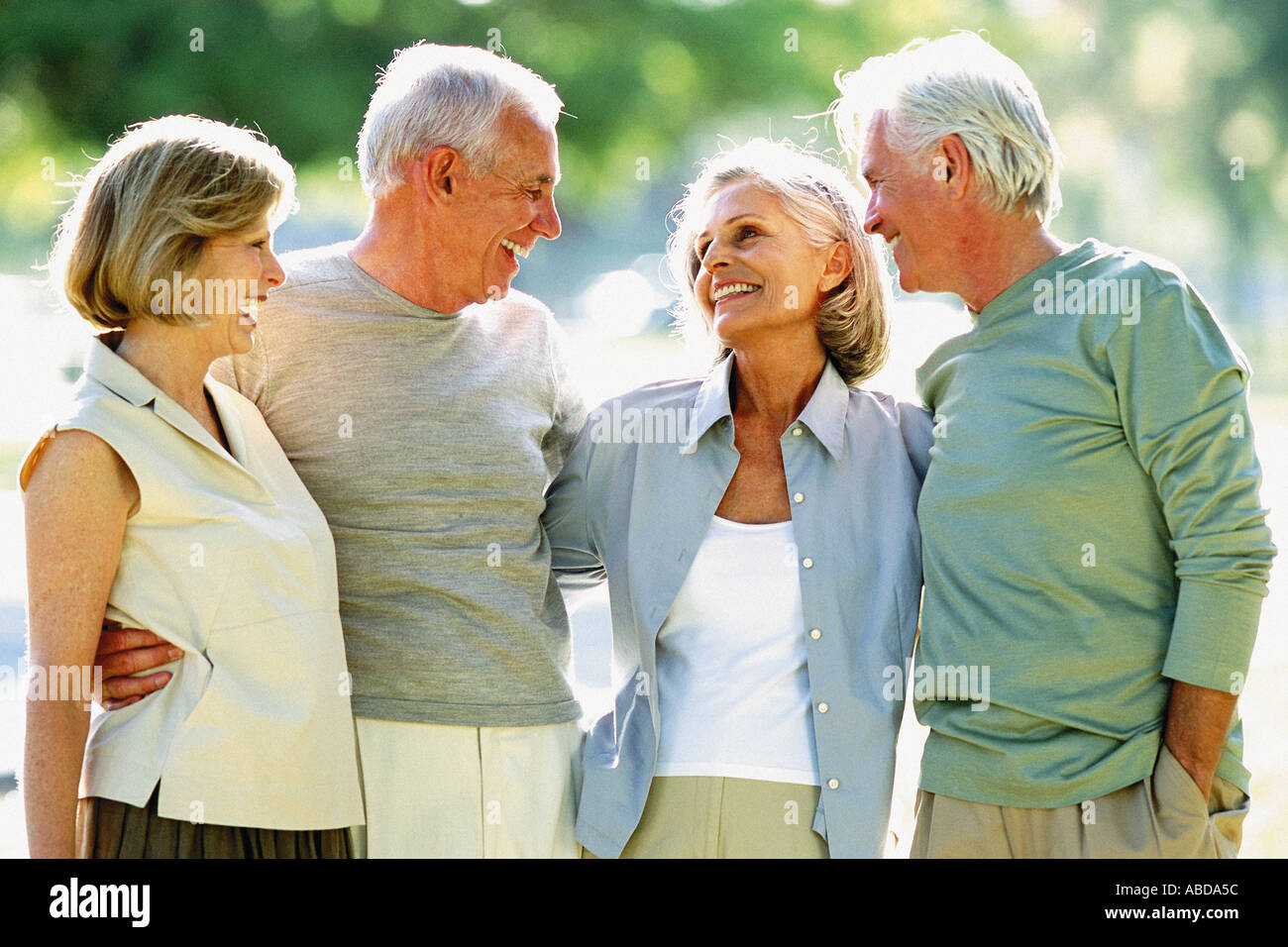 Friends park talking male and female hi-res stock photography and ...