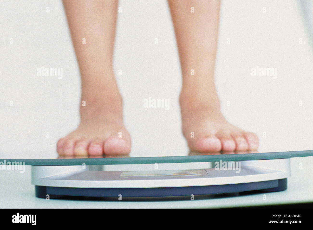 Person on scales hi-res stock photography and images - Alamy