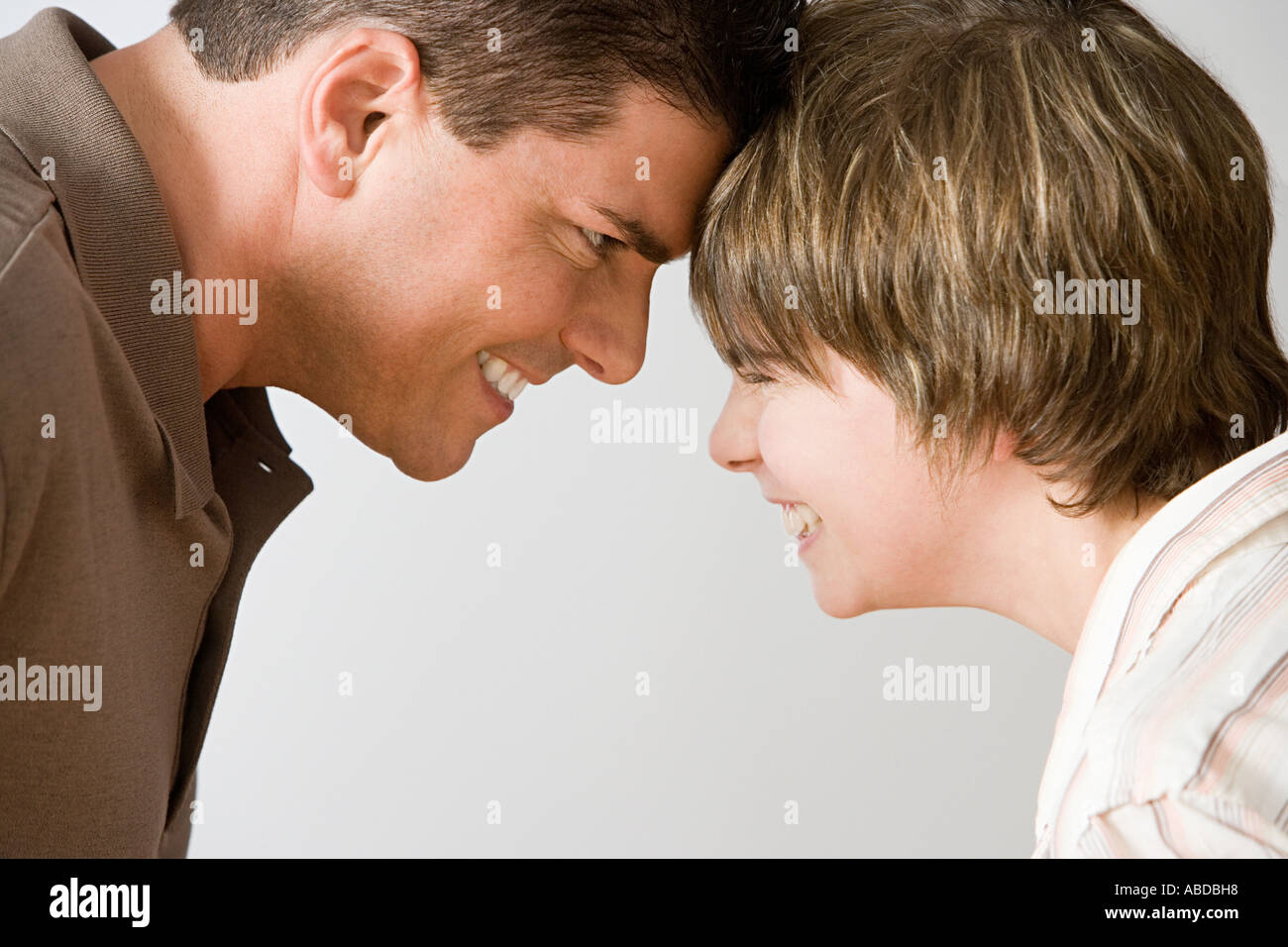 Father and son face to face Stock Photo - Alamy