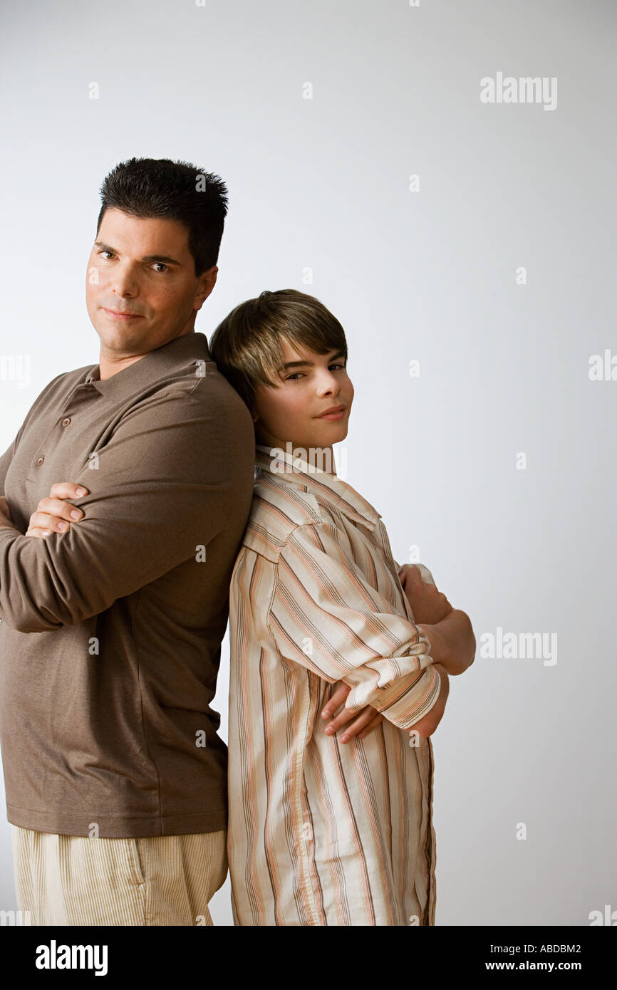 Father and son back to back Stock Photo - Alamy