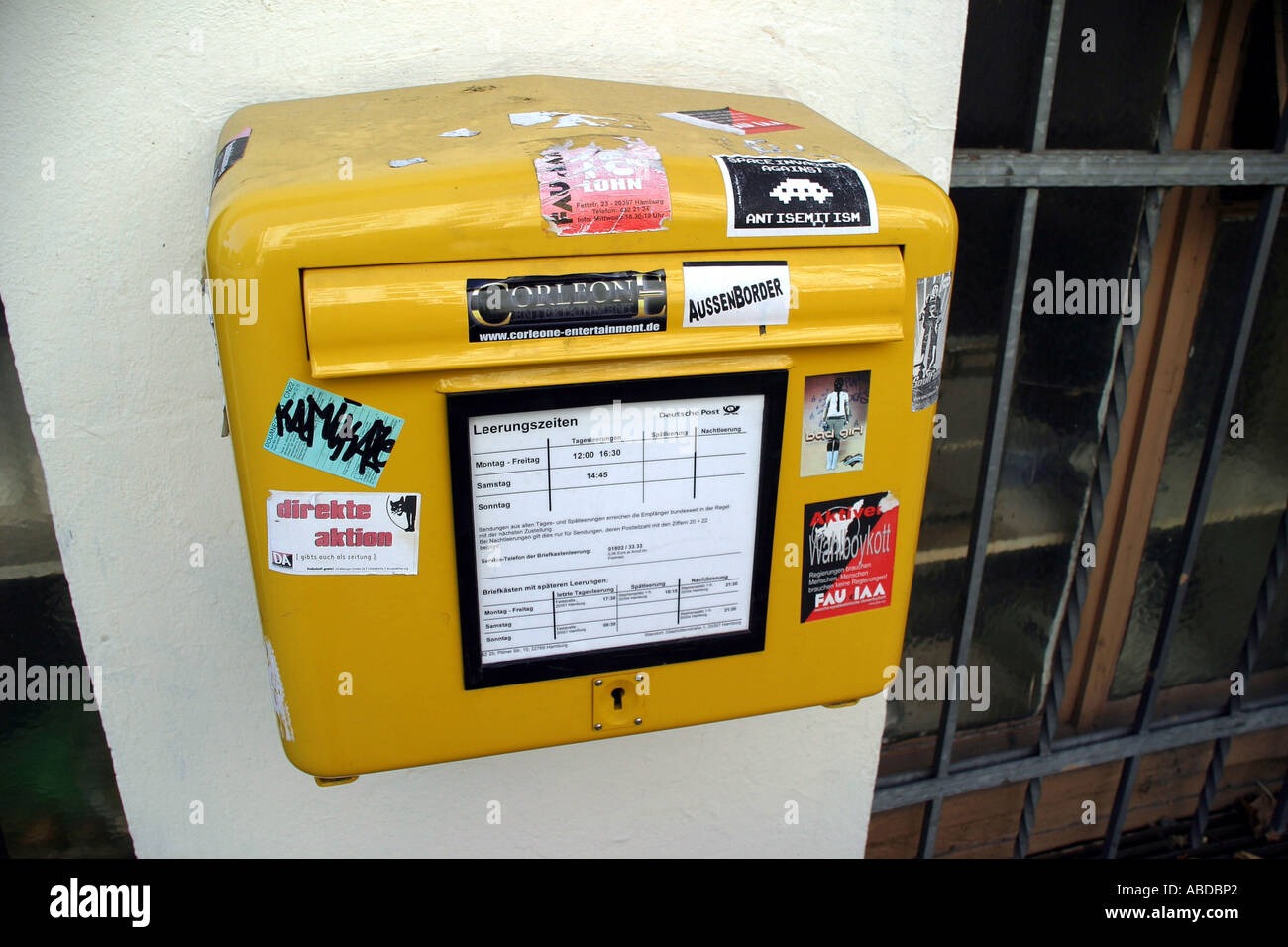 Mail box of the German post office with many stickers Stock Photo - Alamy
