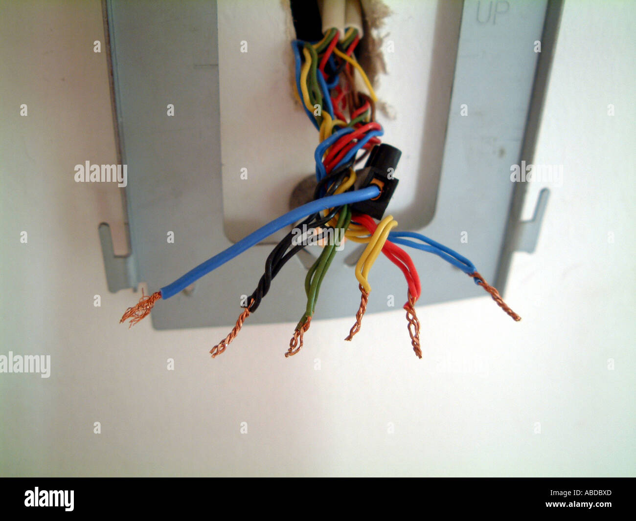 Electrical wire standing out from a wall Stock Photo - Alamy