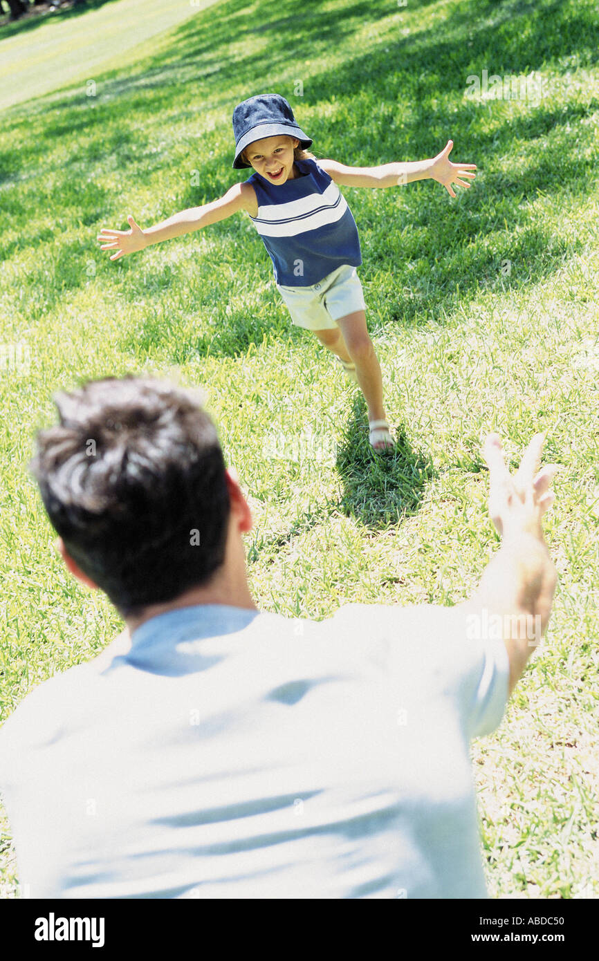 Girl running to her father Stock Photo - Alamy
