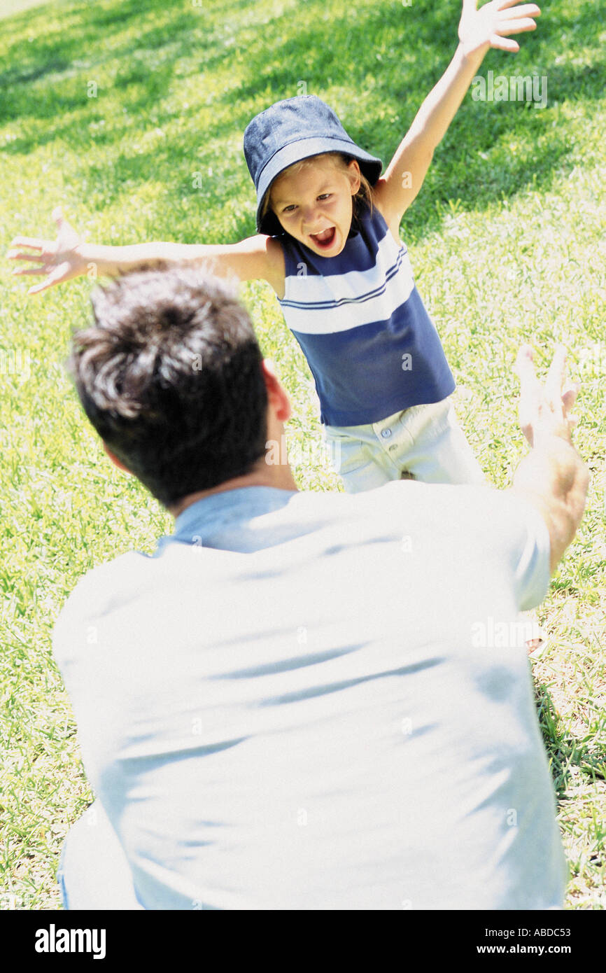 Girl running to her father Stock Photo - Alamy