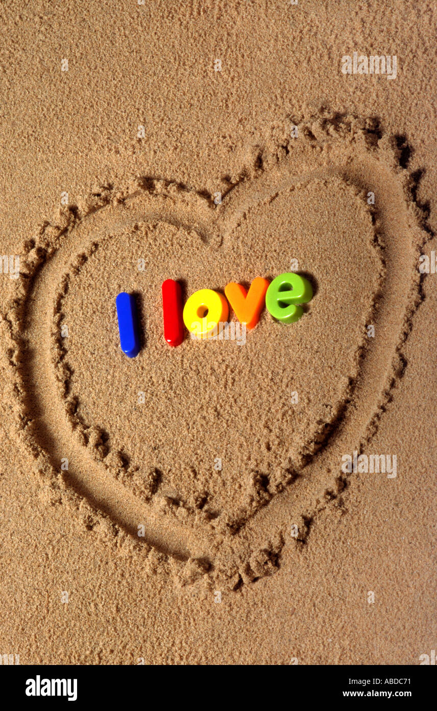 Heart shape on sand Stock Photo - Alamy