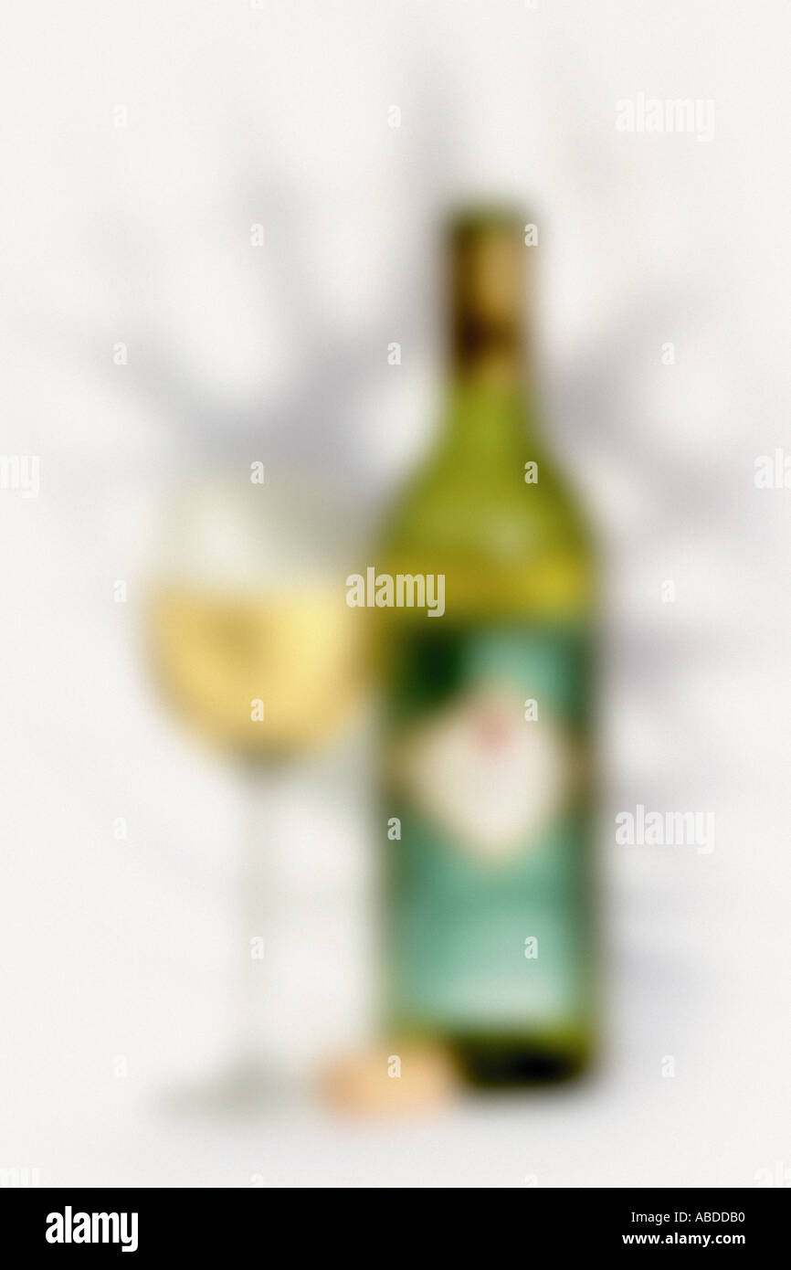 Glass of white wine and bottle Stock Photo - Alamy