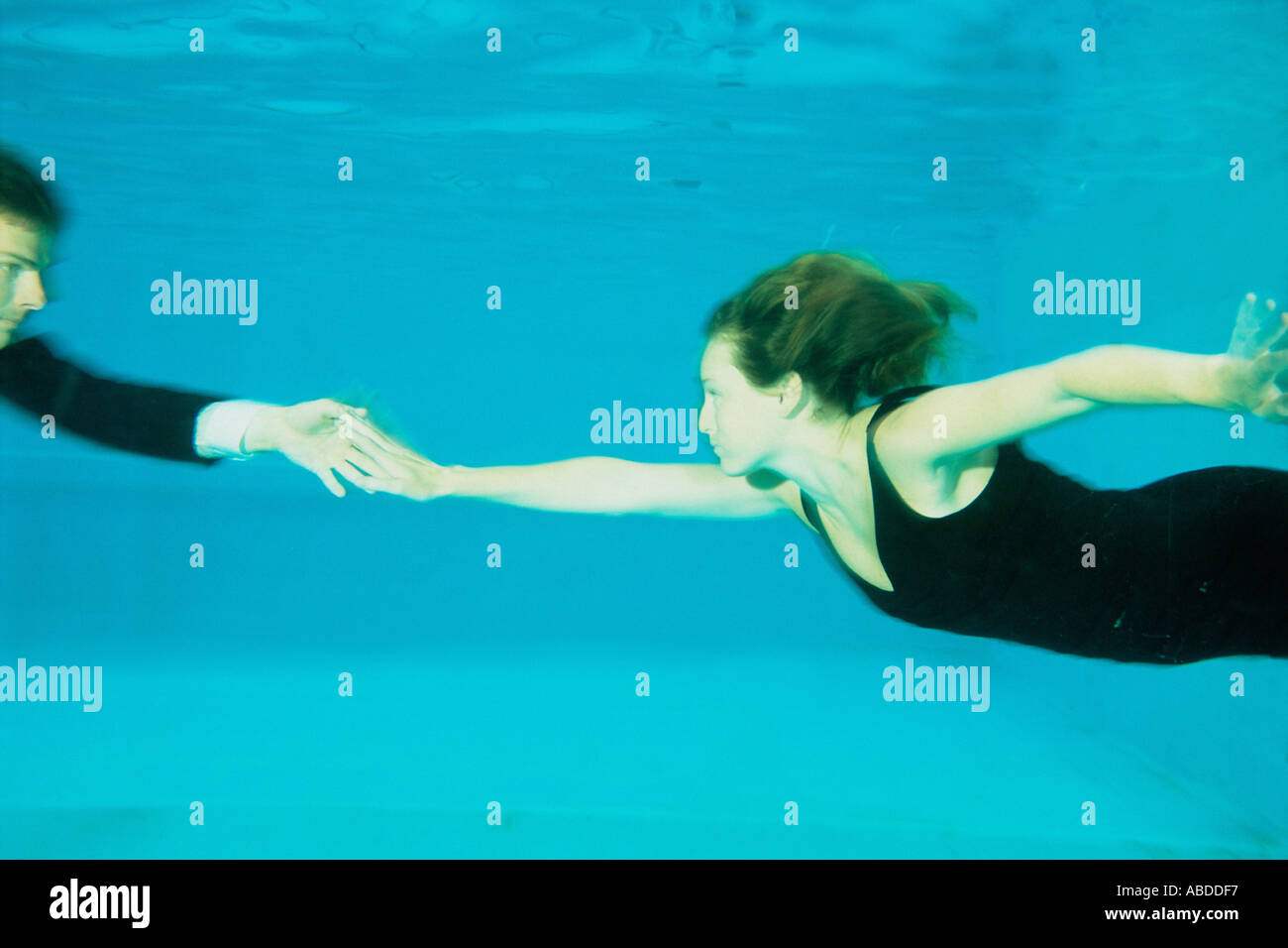 A couple dancing in a swimming pool Stock Photo - Alamy