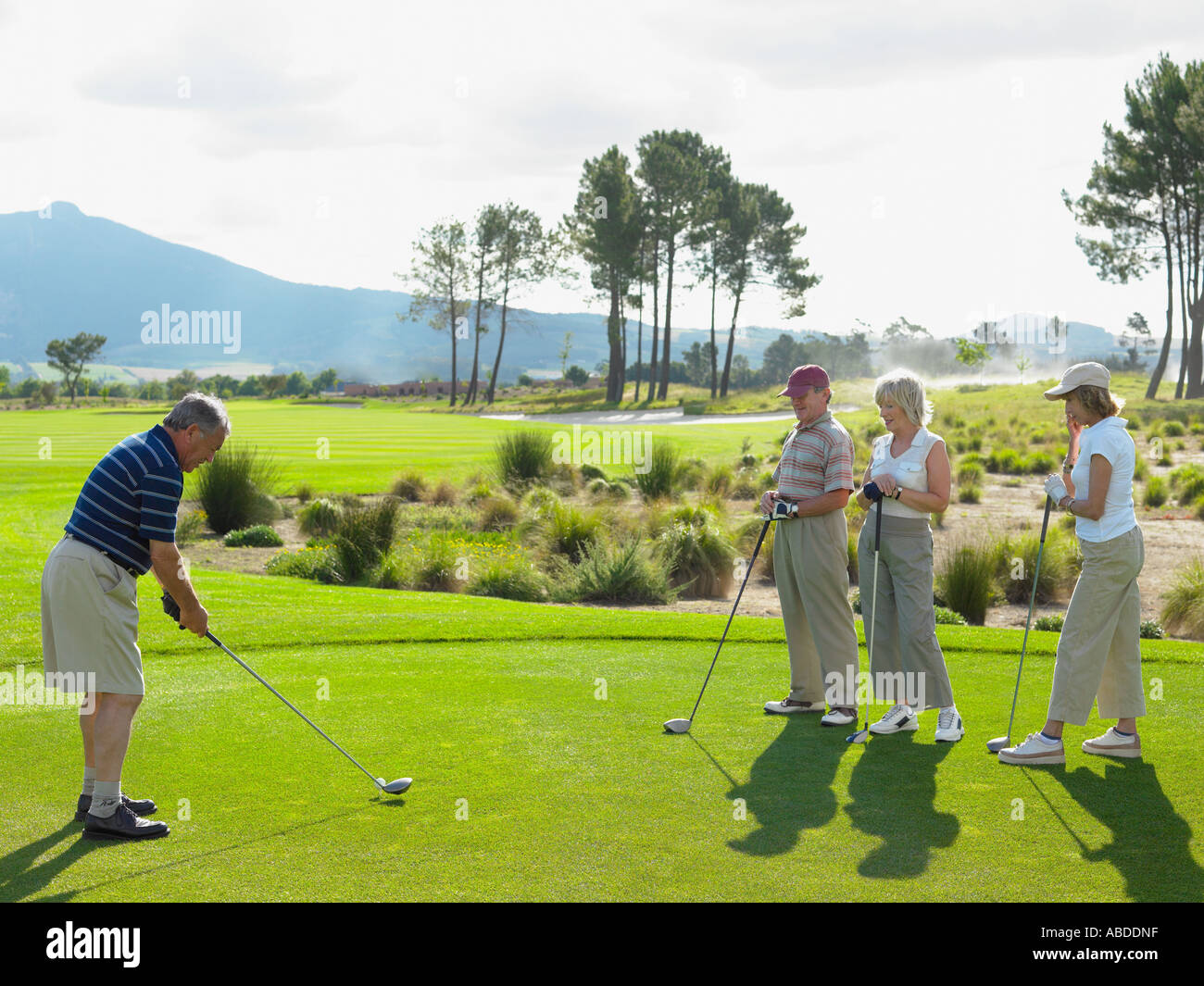 Older woman playing golf hi-res stock photography and images - Alamy
