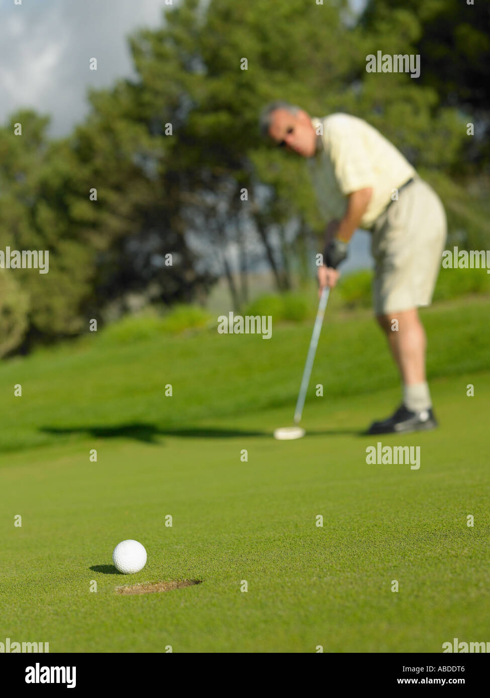 Old man holding golf club hi-res stock photography and images - Alamy