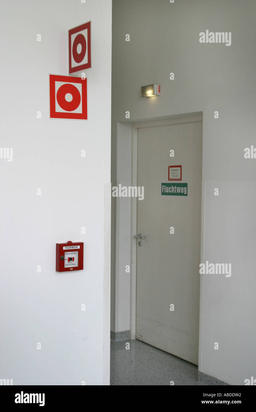 Fire detector and escape route - fire door Stock Photo - Alamy