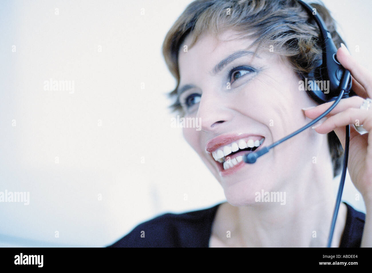 A detail of a receptionist with a headset Stock Photo - Alamy
