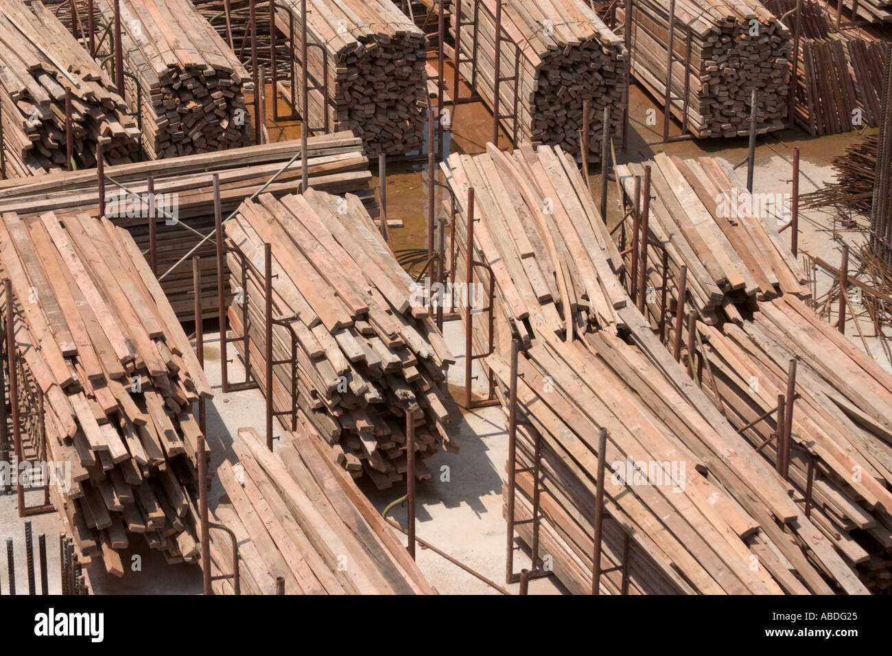 many wooden planks at construction site for building Stock Photo - Alamy