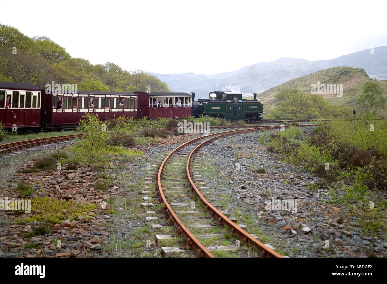 Narrow gauge steam train arriving at Dduallt station in the hills of ...