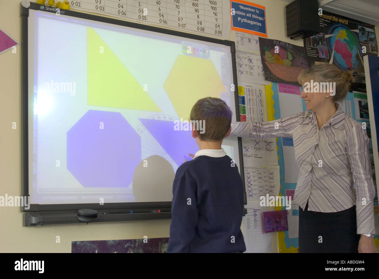 child working at interactive whiteboard in lesson time Stock Photo - Alamy