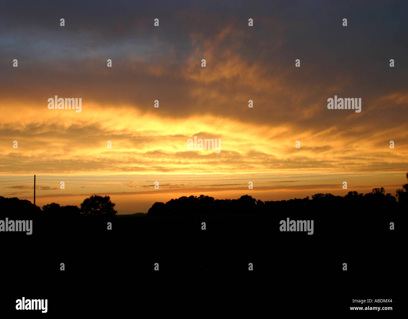 Sunset sky and landscape Stock Photo - Alamy