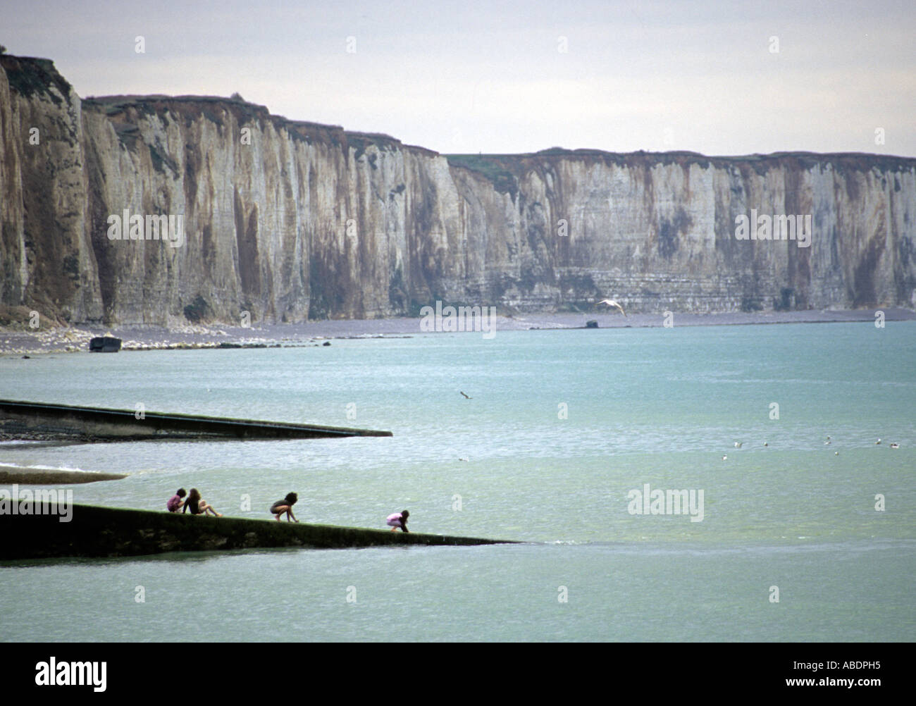 France, Normandy cliffs and children playing on sea coast Stock Photo ...