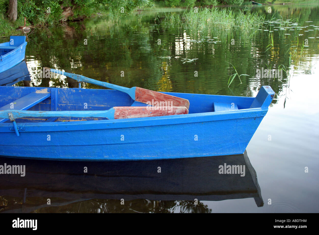 Blue fishing boat Stock Photo - Alamy