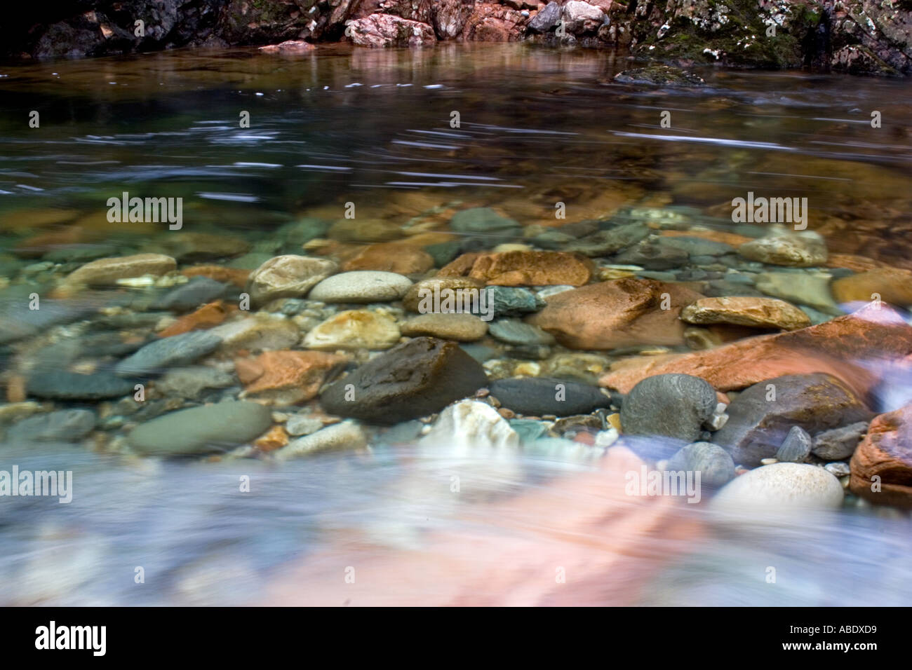 Clear water flowing across stone hi-res stock photography and images ...