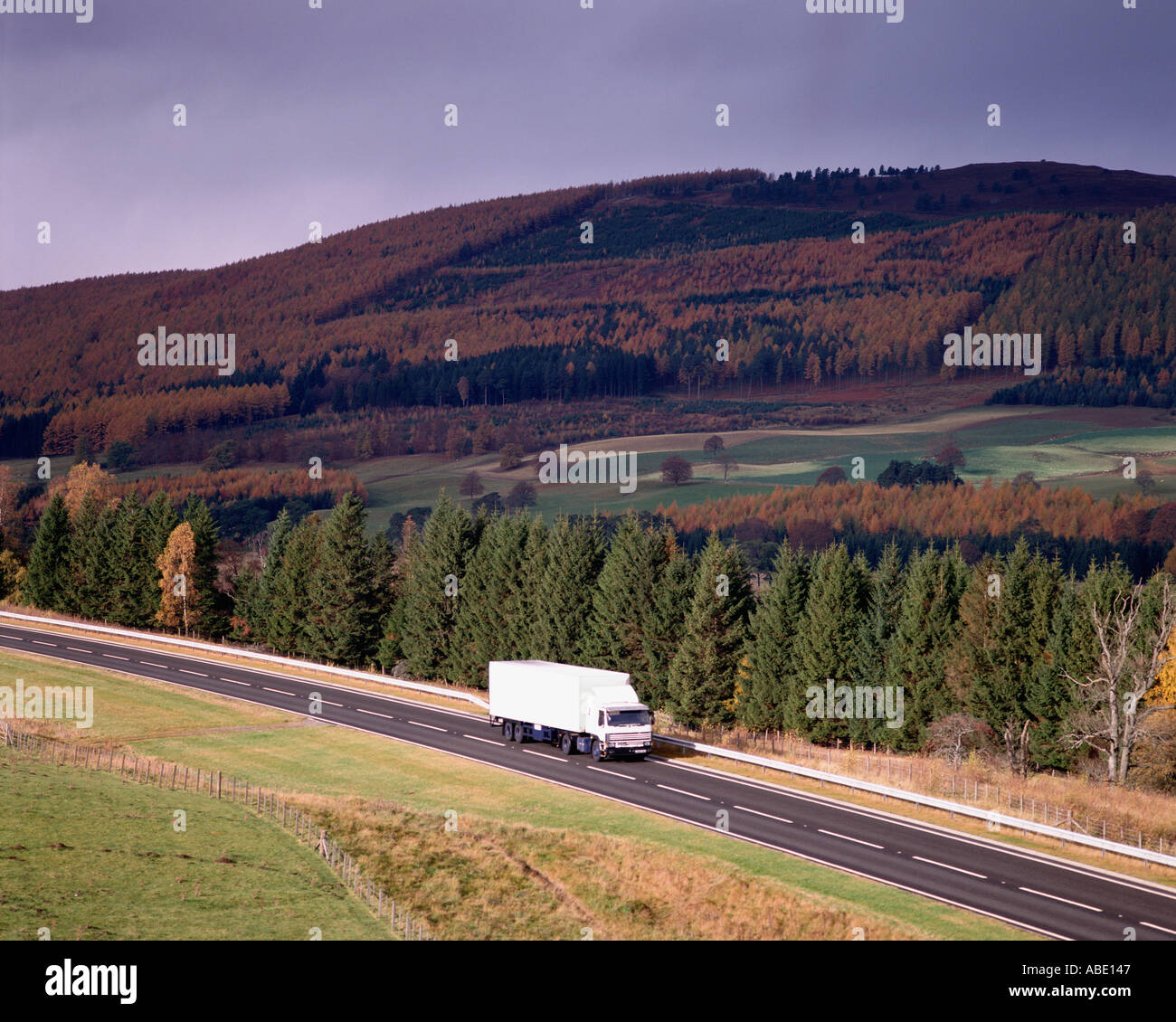 Road through countryside Stock Photo - Alamy