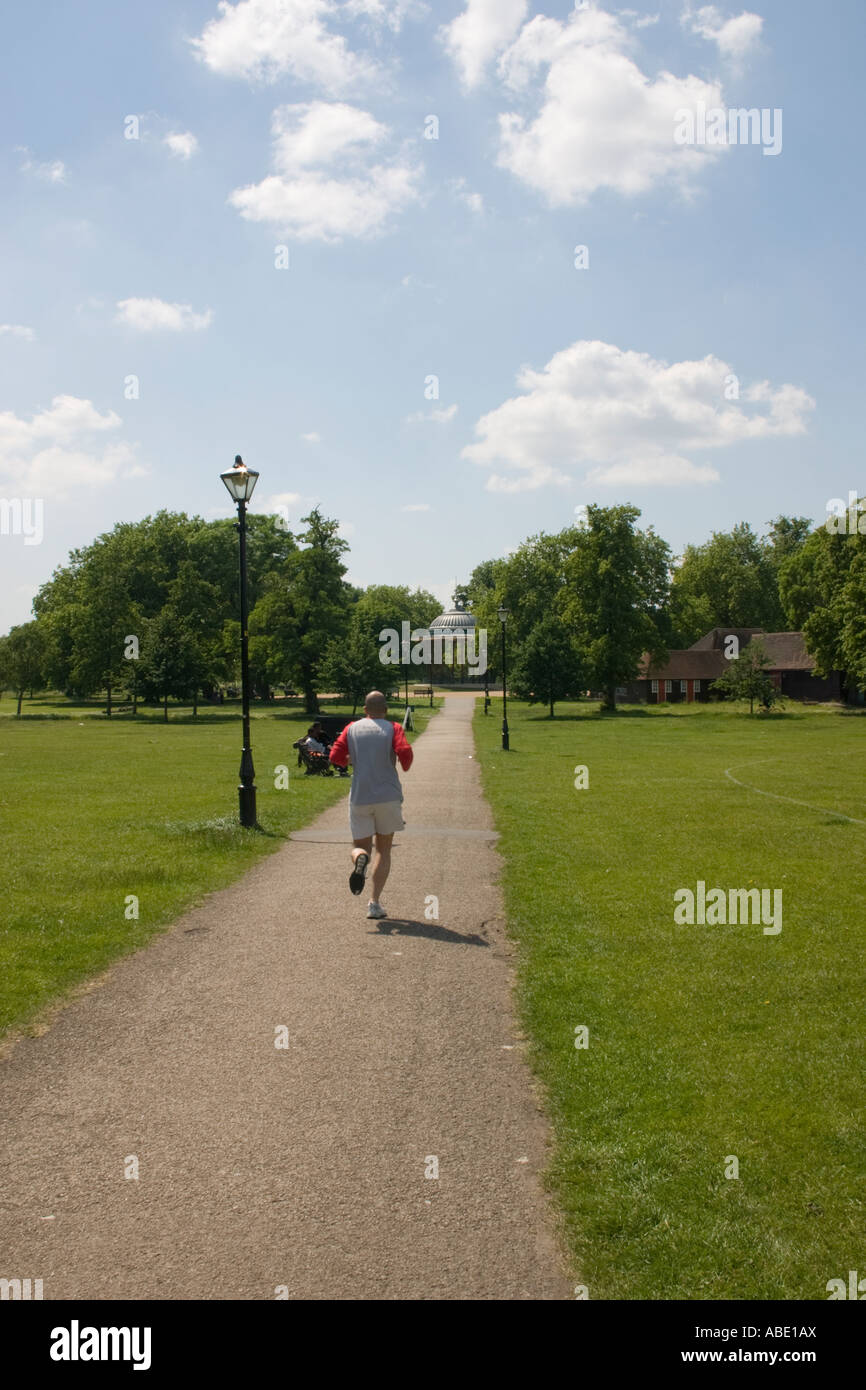 Jogger jogging on clapham common hi-res stock photography and images ...