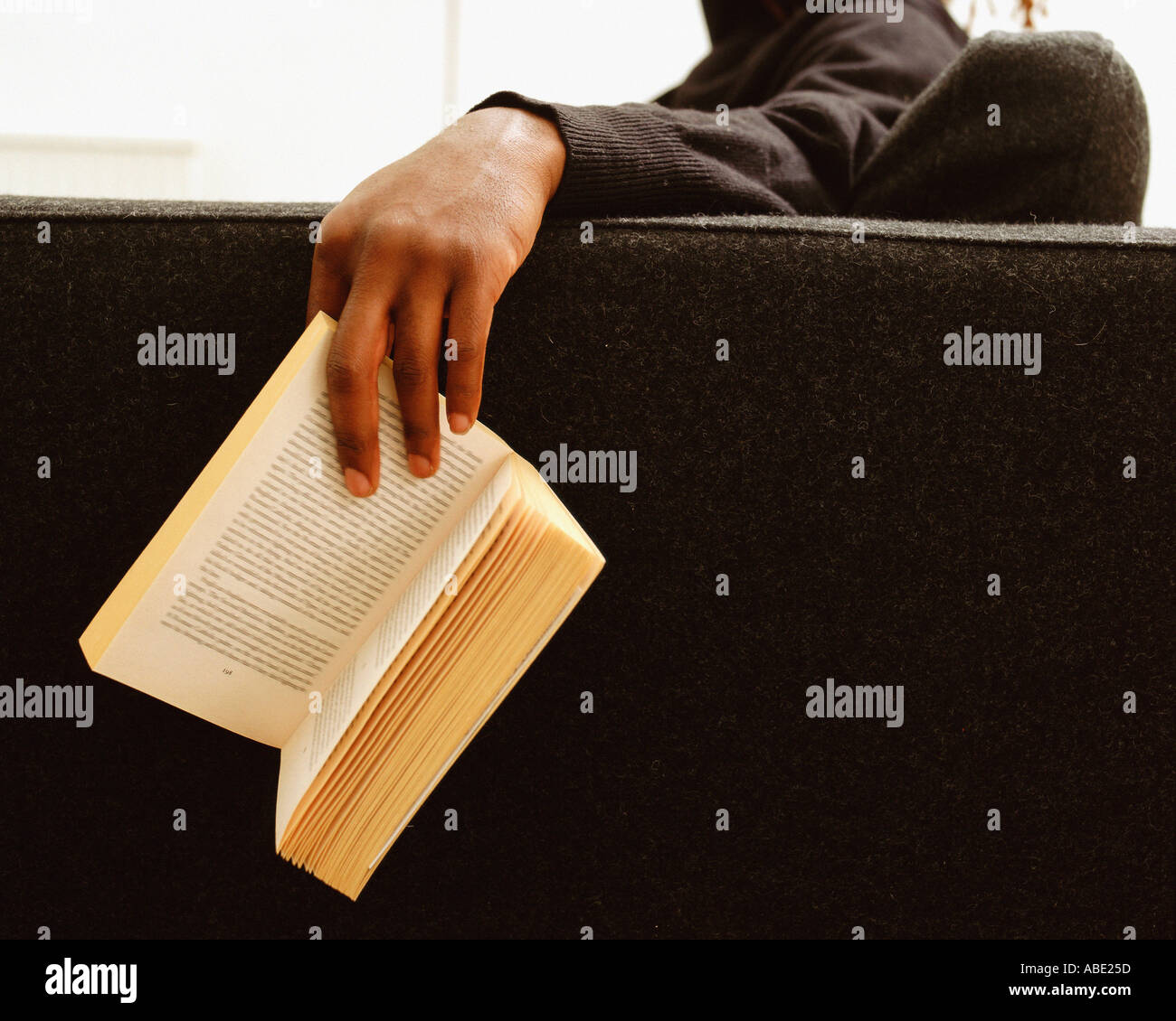 African hand holding book hi-res stock photography and images - Alamy