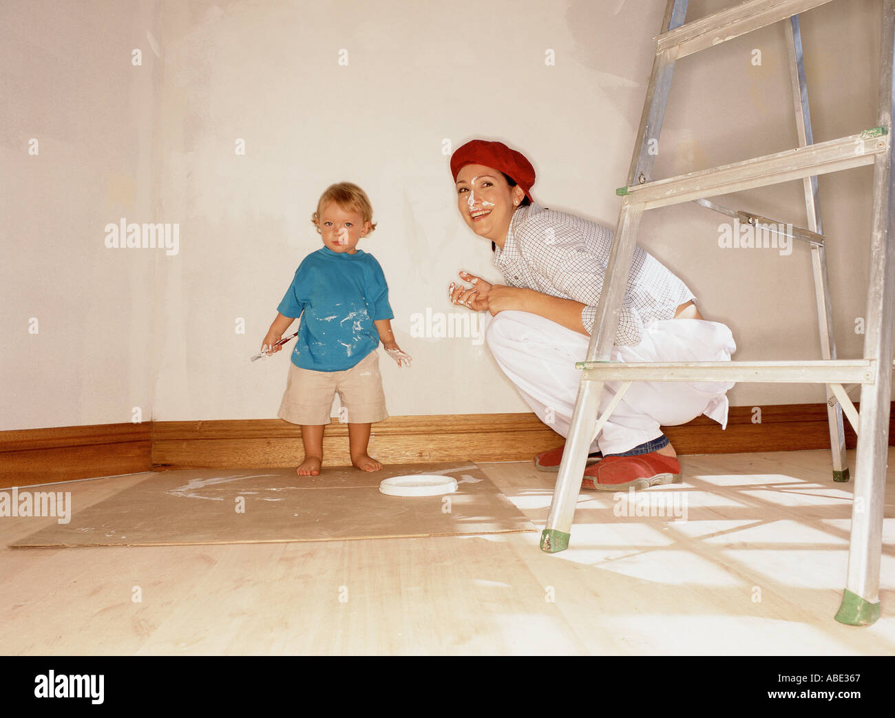 Mother and child decorating Stock Photo - Alamy