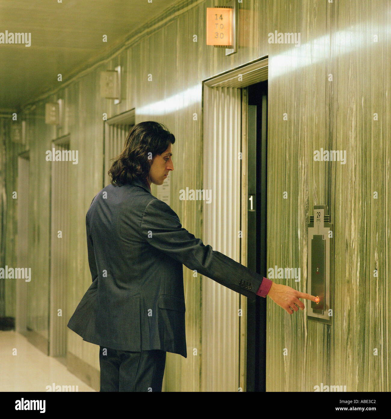 Man waiting for elevator Stock Photo - Alamy