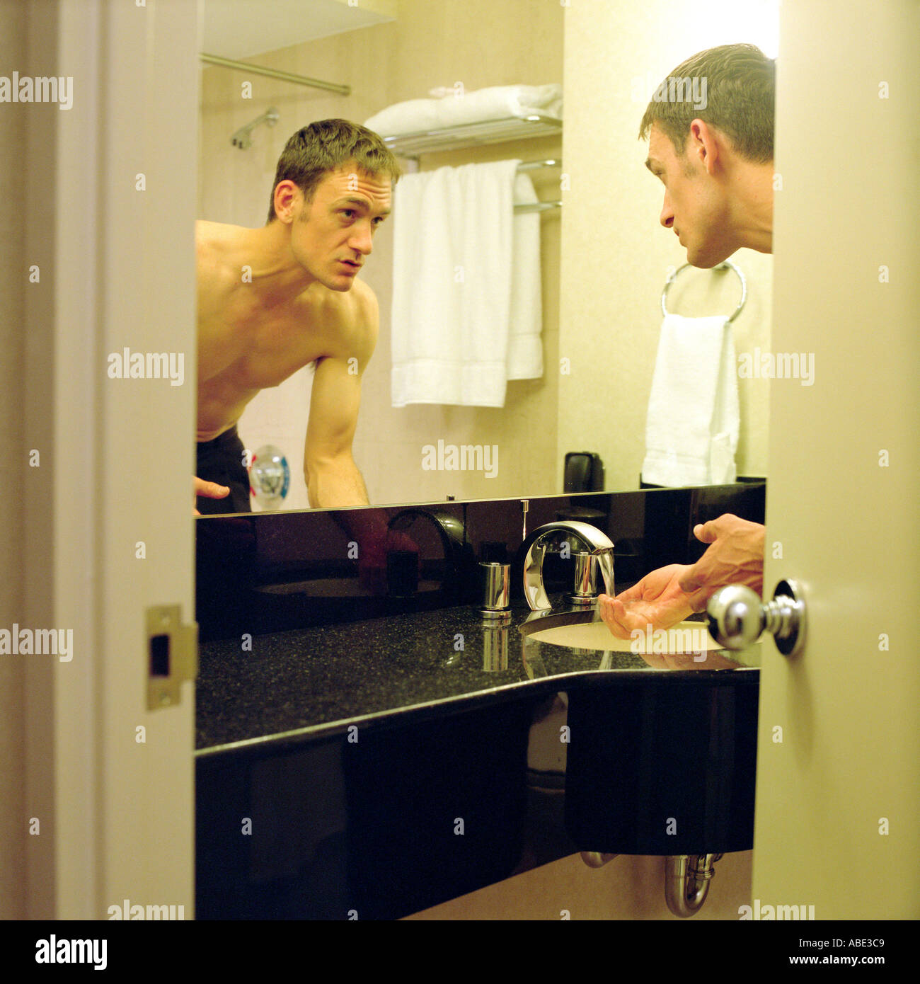 Man washing in bathroom Stock Photo - Alamy