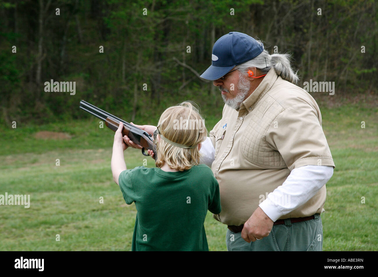 Boy Learning Gun Safety Stock Photo - Alamy