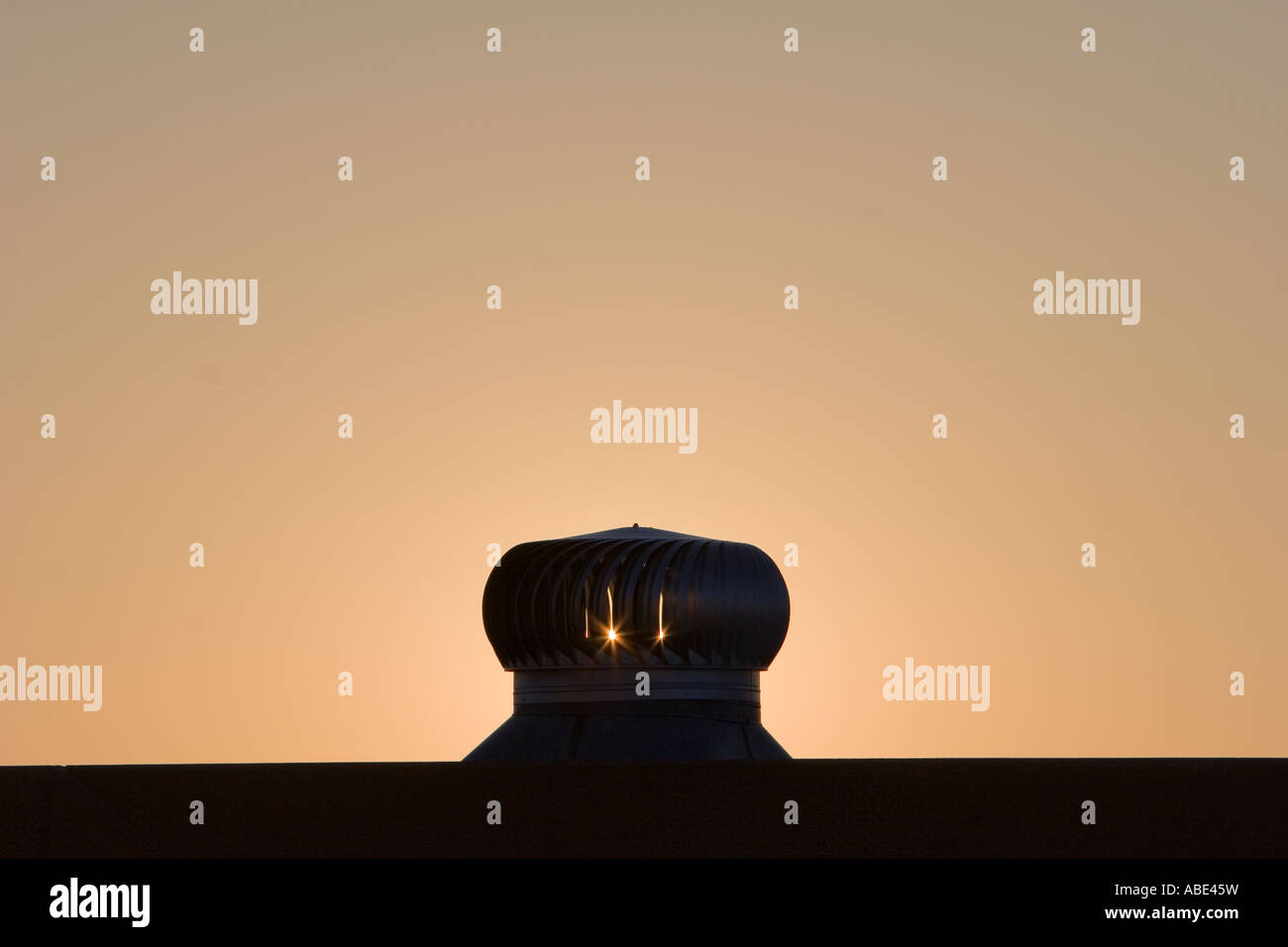 Spinning metal rooftop heating vent Stock Photo - Alamy