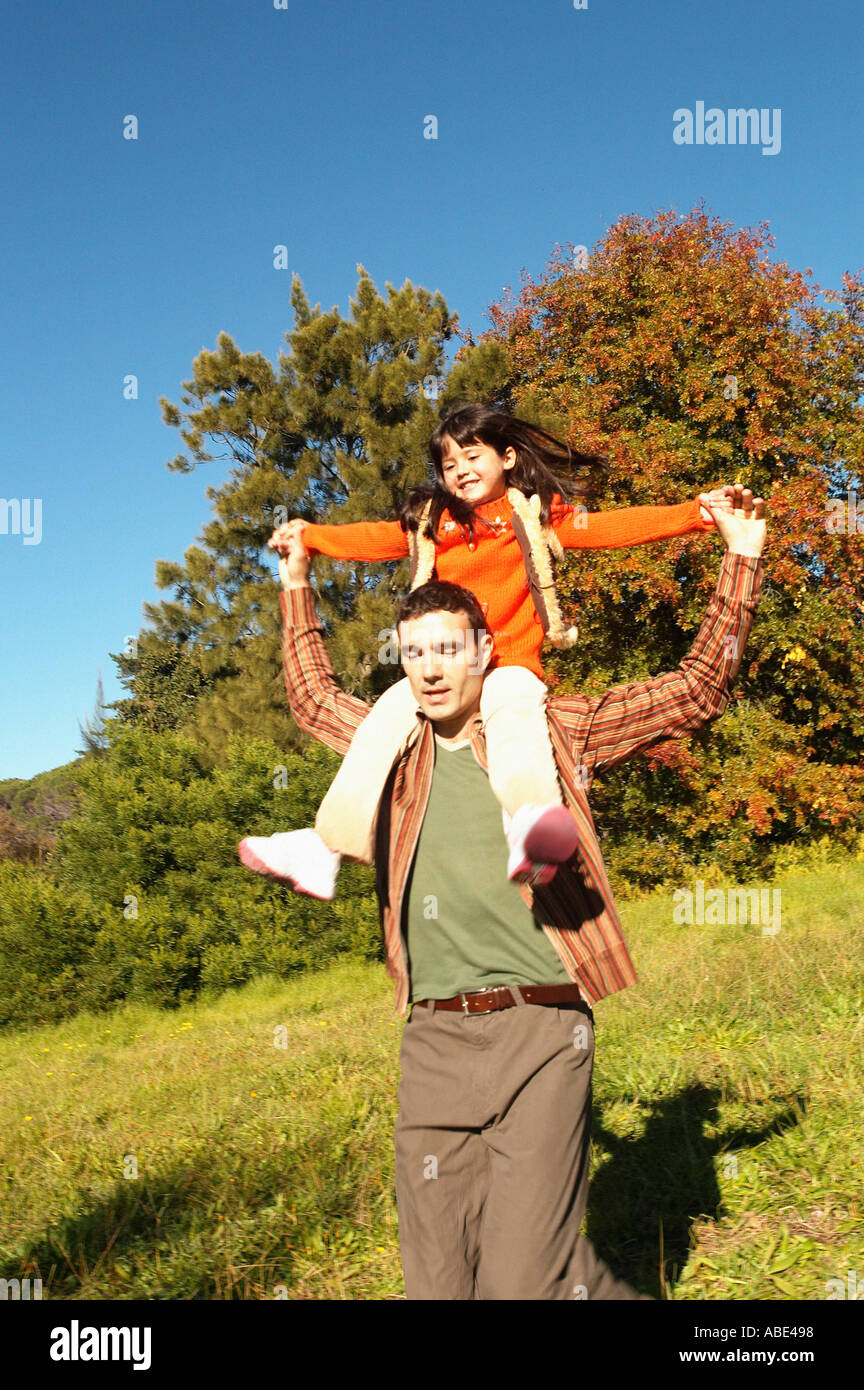 Father shoulder carrying daughter Stock Photo - Alamy