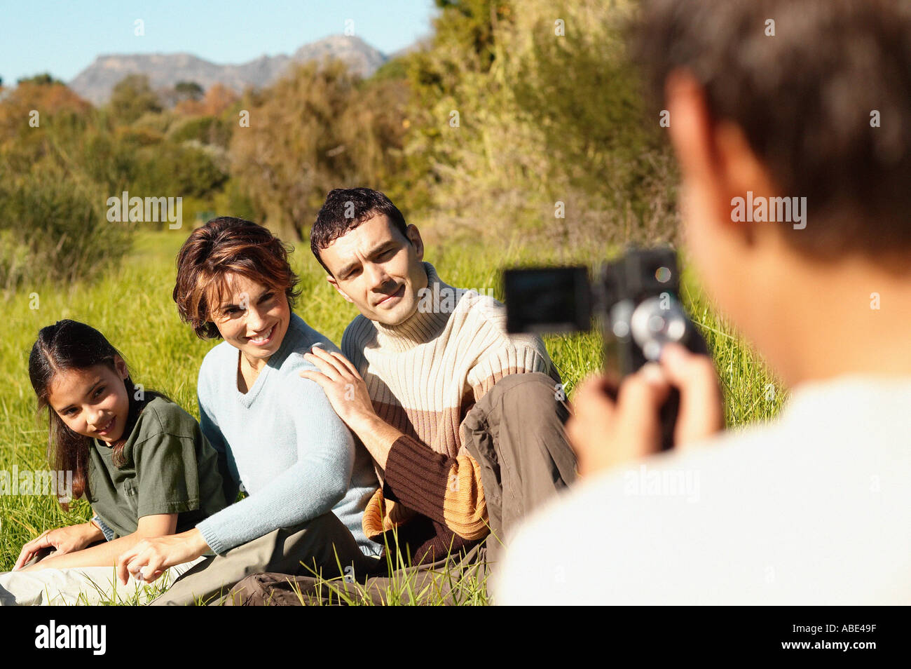 Family posing for video camera Stock Photo - Alamy