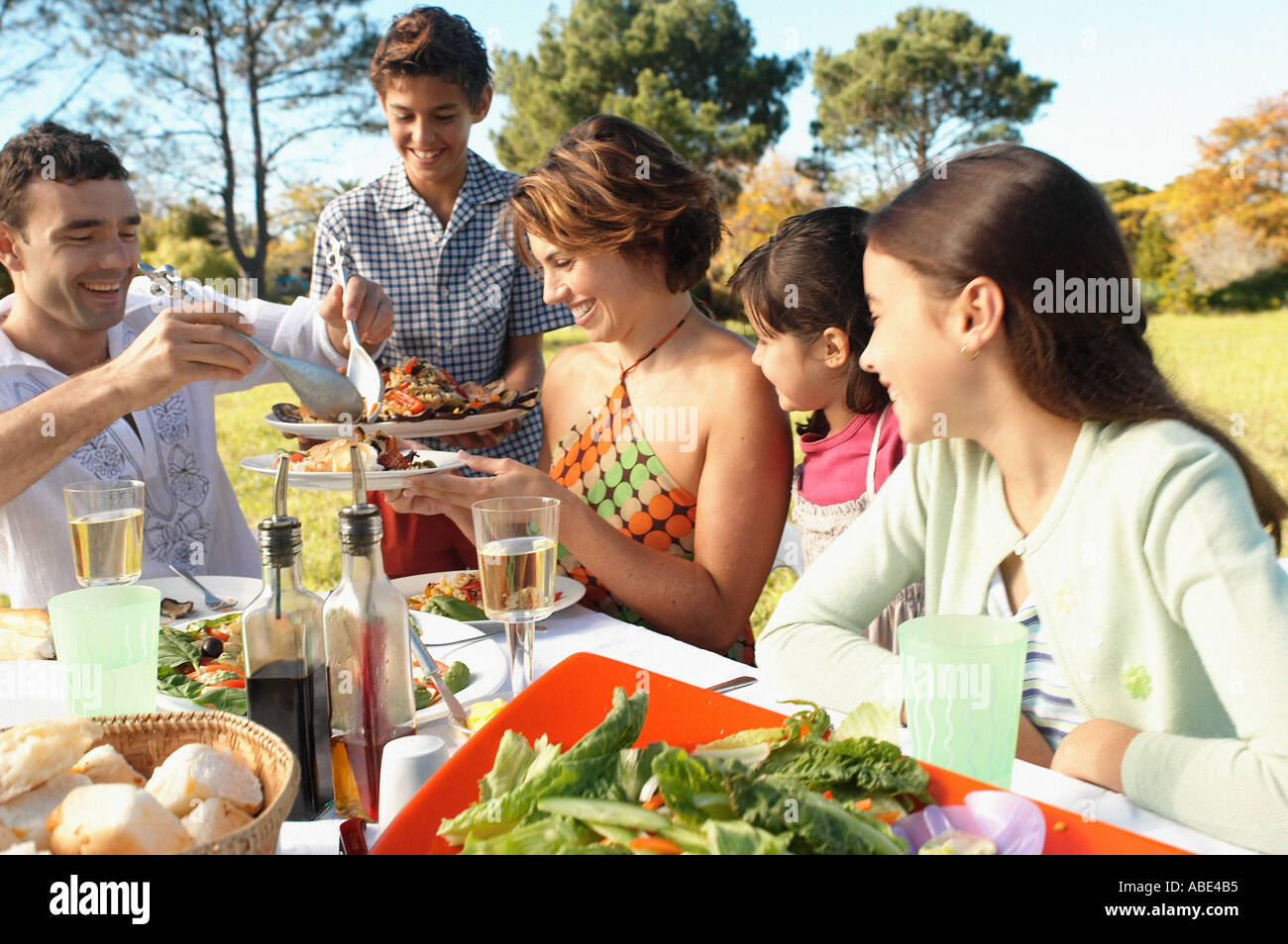 Family eating in garden Stock Photo - Alamy