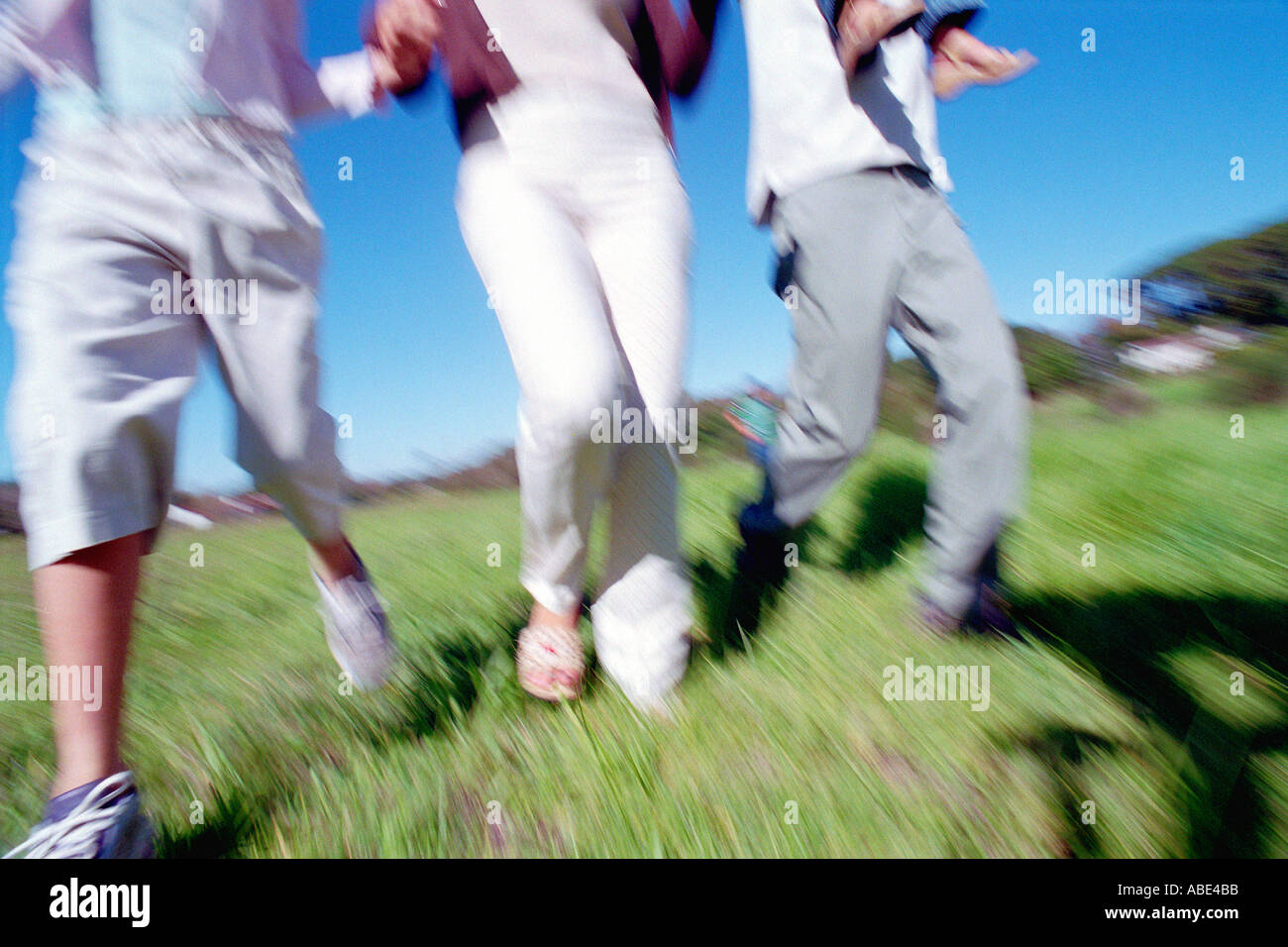 People running in field Stock Photo - Alamy