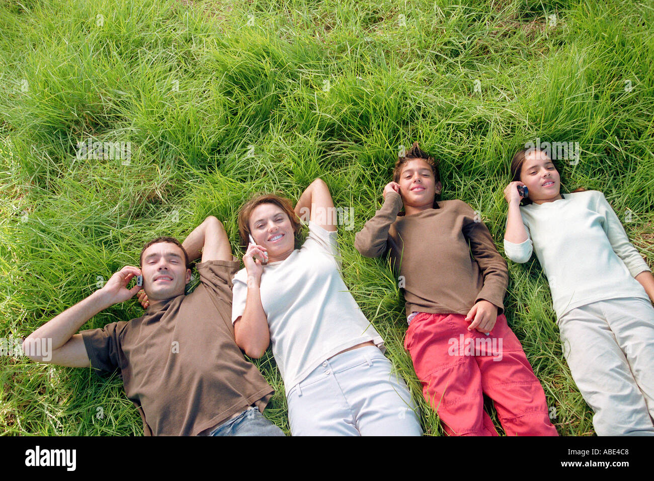 Family using phones hi-res stock photography and images - Alamy