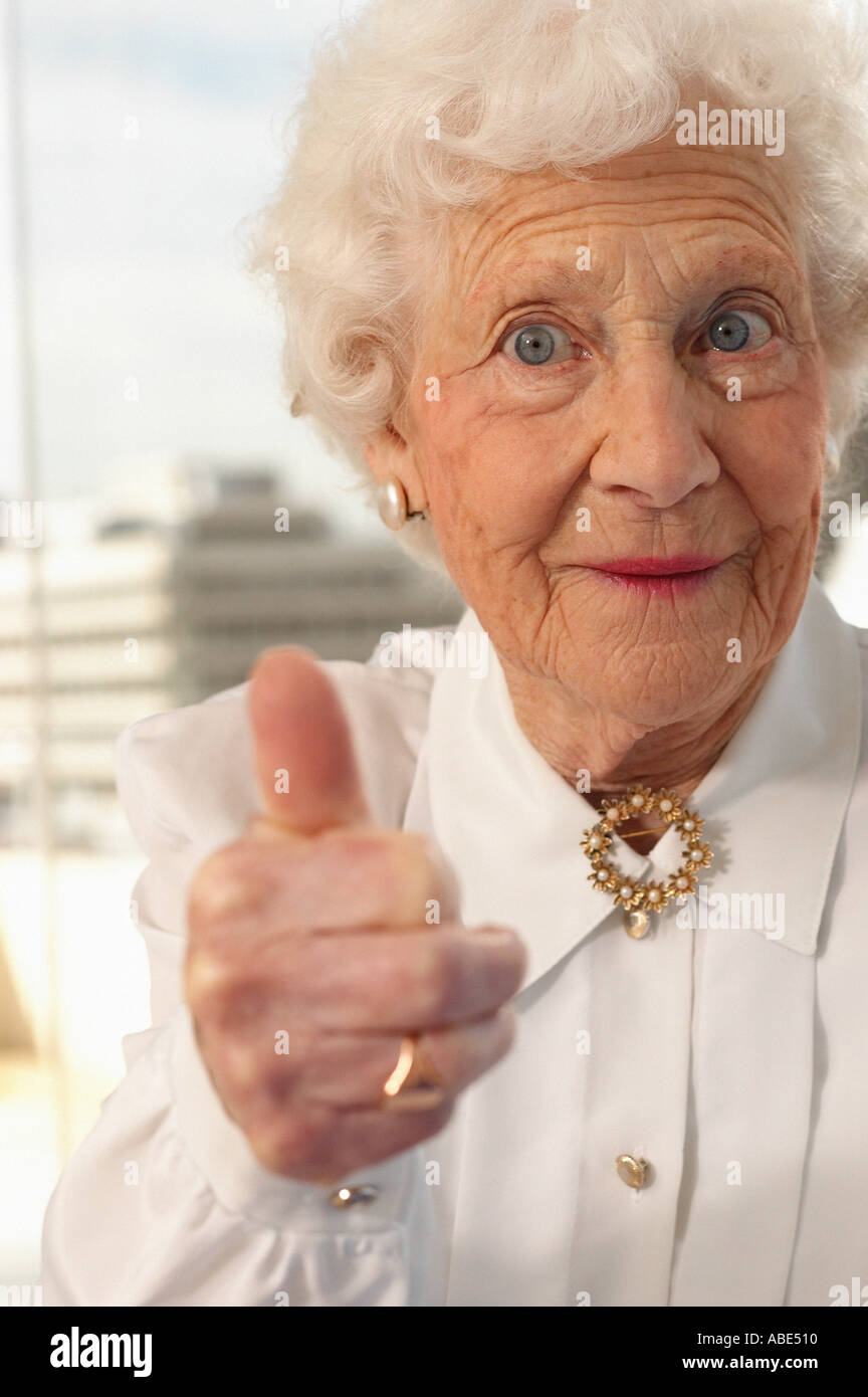 Elderly woman giving the thumbs up Stock Photo - Alamy