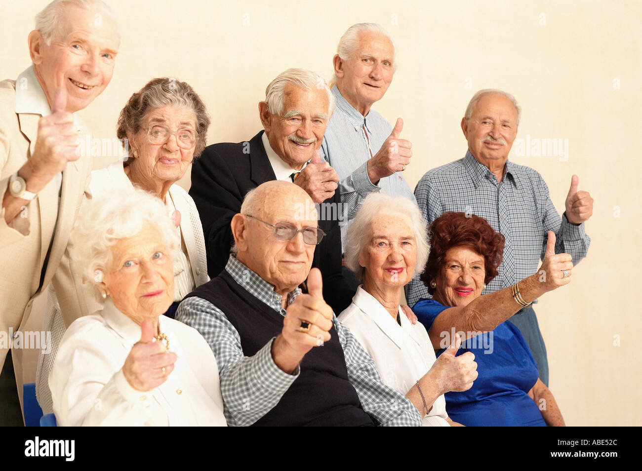 Elderly giving thumbs up sign Stock Photo - Alamy