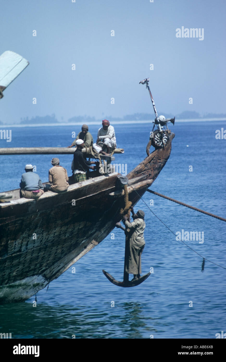 The anchor of a ghanjah, a type of Arab dhow, gets maintenance. A model ...