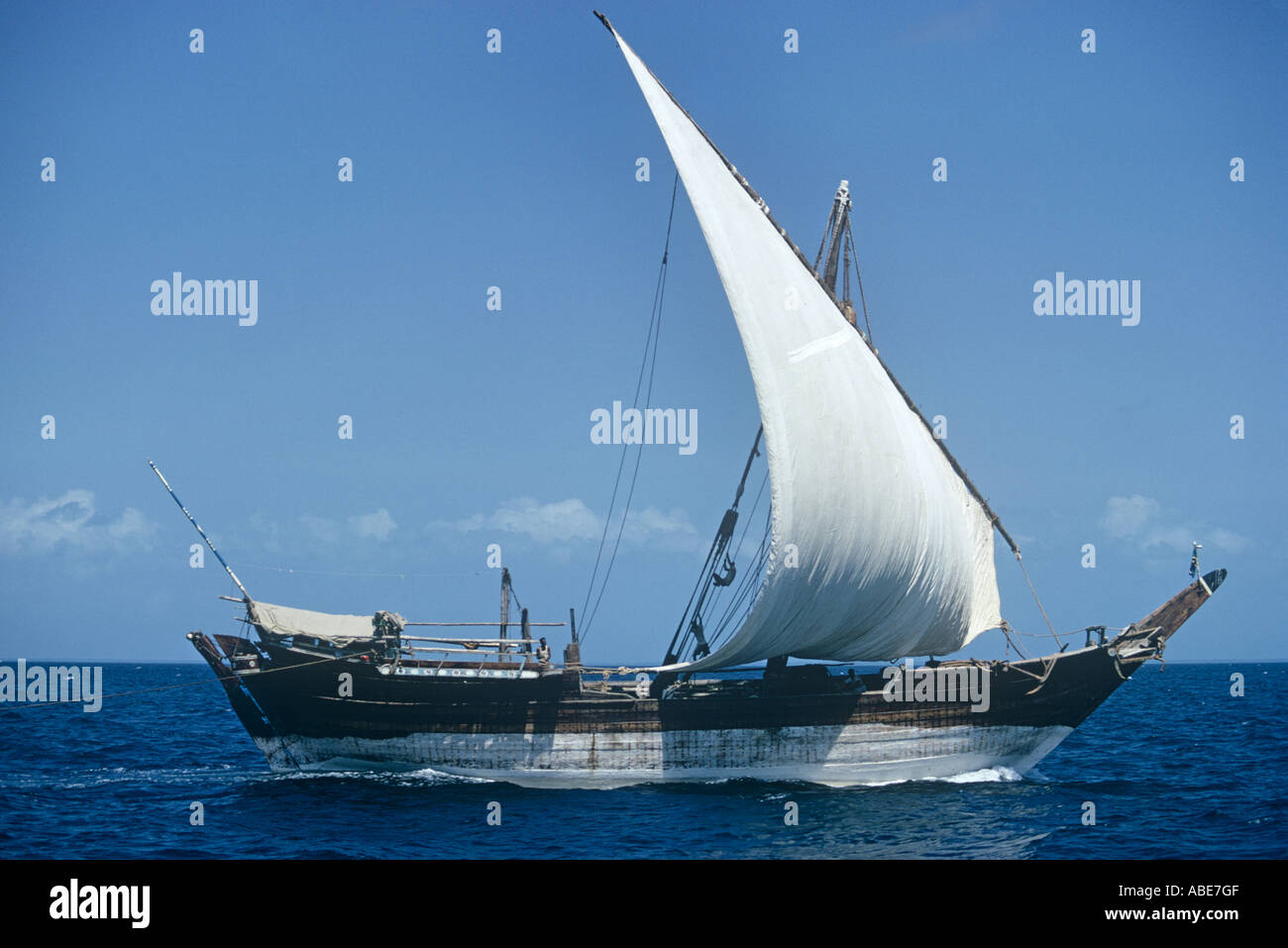Side view of an Arab dhow under sail--a fullsize boom high in the water ...