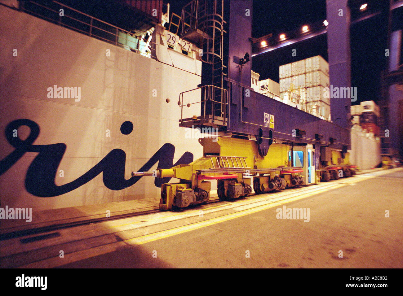 Container crane by a cargo ship Stock Photo - Alamy