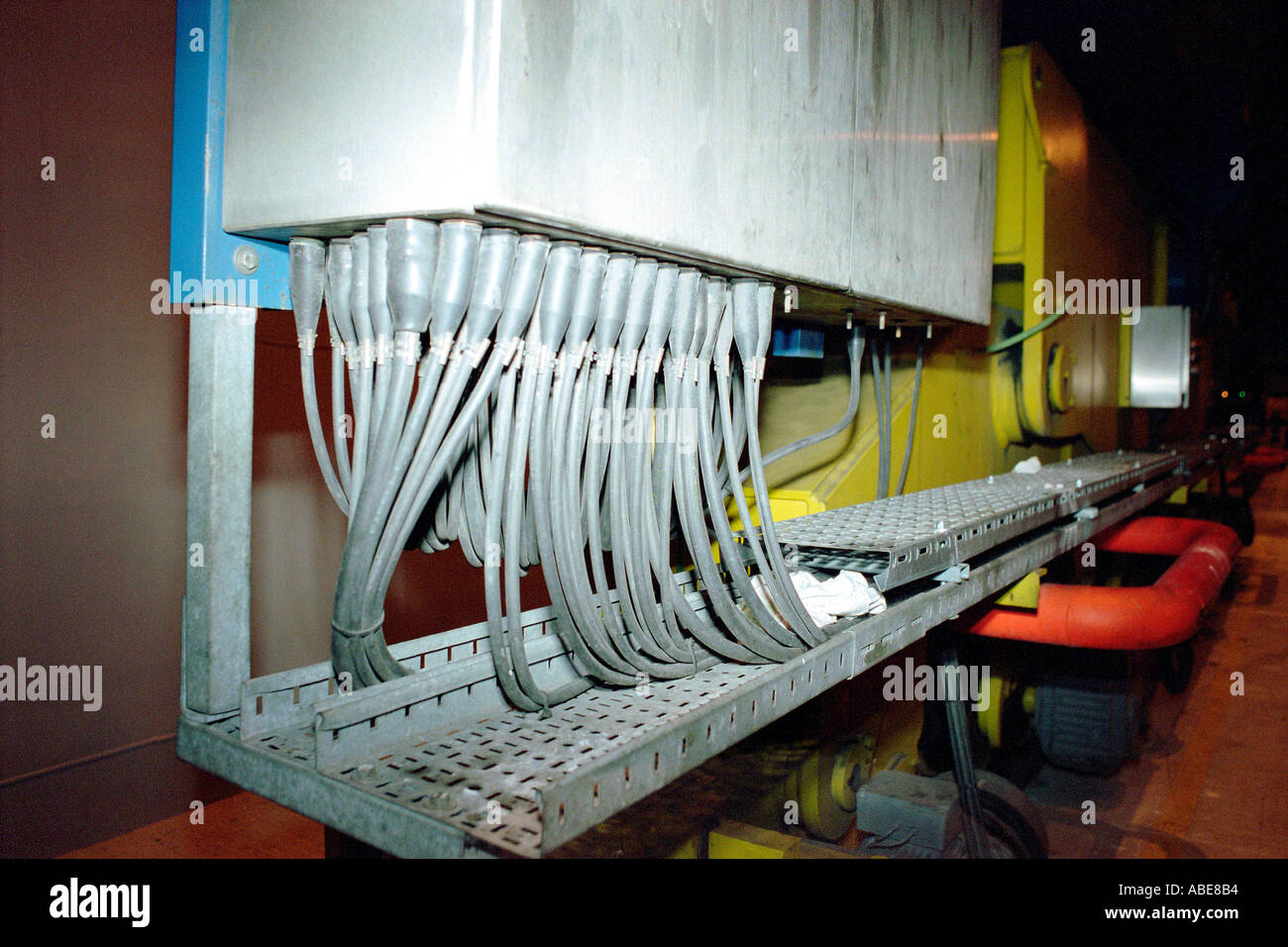 Electric cables leading to container crane Stock Photo - Alamy