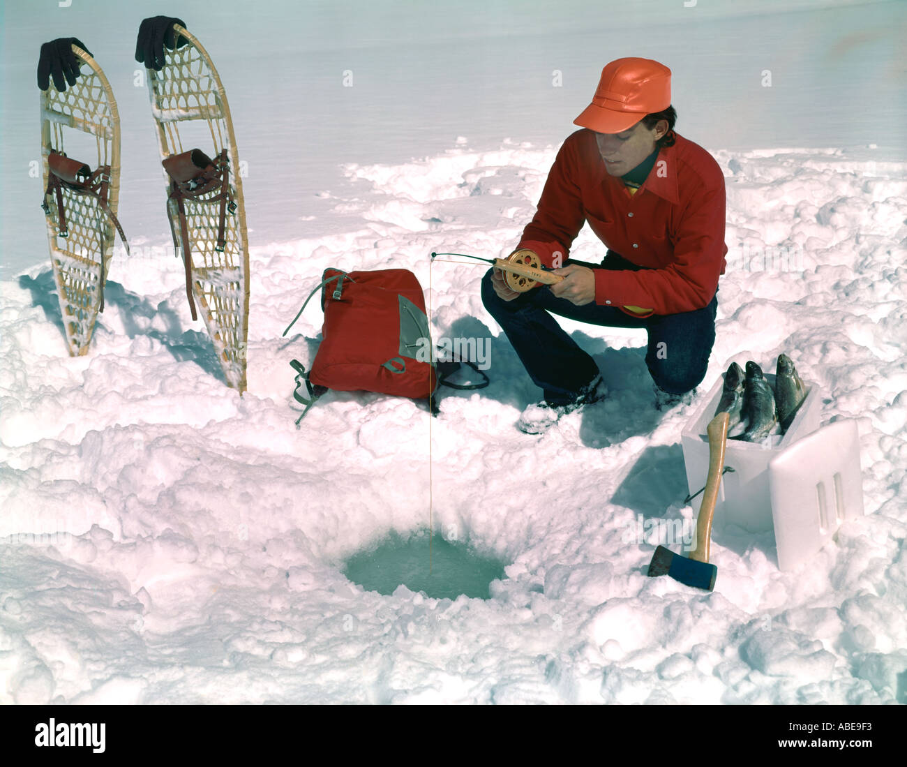 Ice fishing on an Idaho frozen lake Stock Photo - Alamy