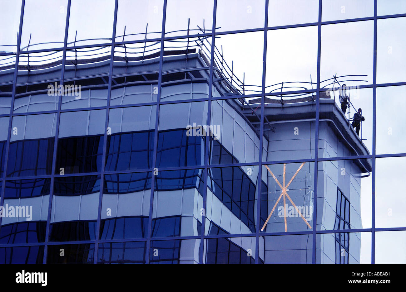 Contemporary office building with broken window Stock Photo - Alamy