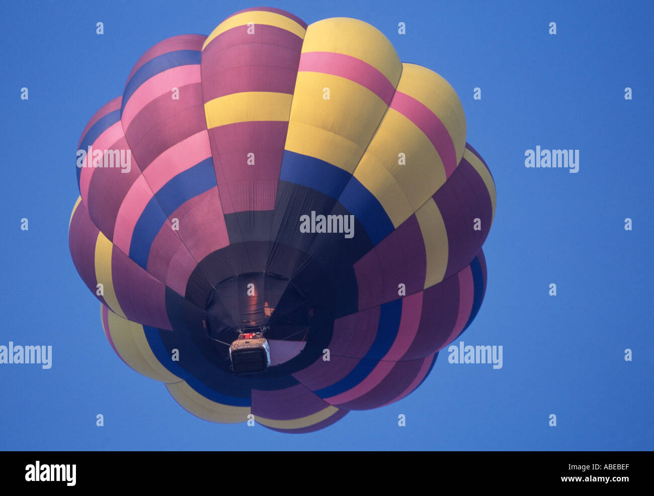 Gaining altitude, a hot air balloon is seen ffrom the bottom up Stock ...