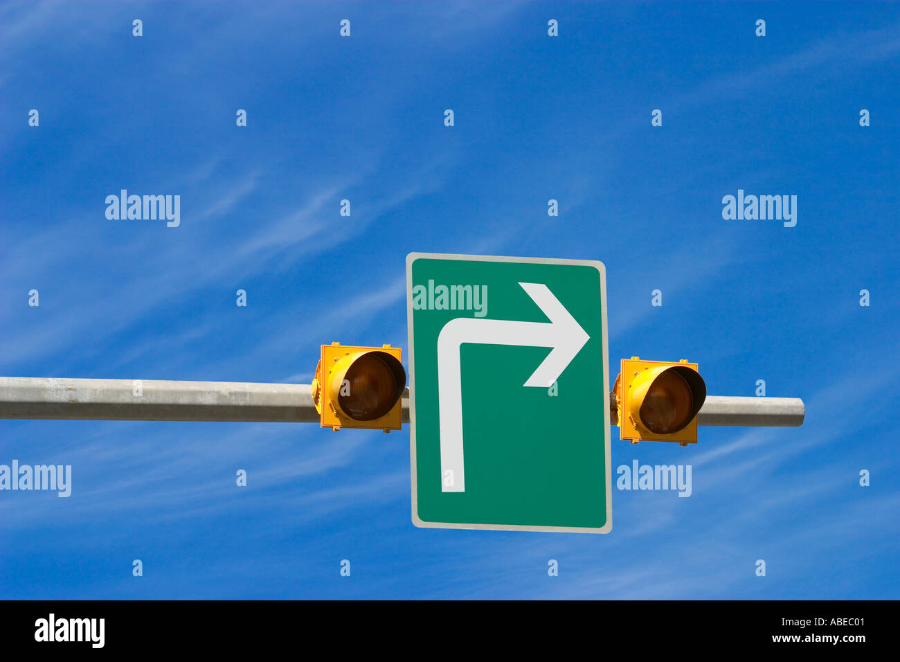 Overhead sign with angled directional arrow indicating must turn right ...