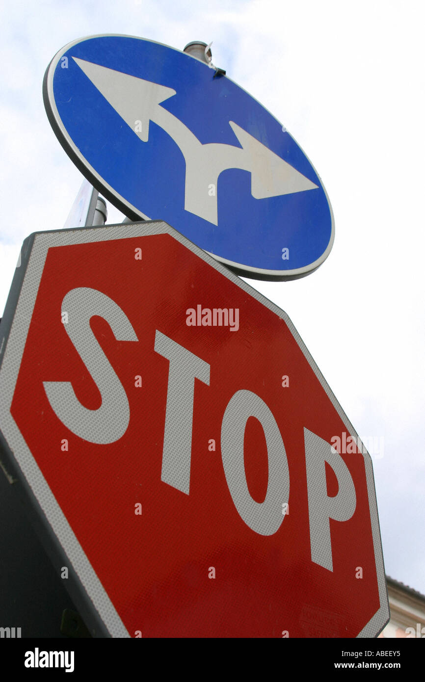 Stop sign and directional markers Stock Photo - Alamy