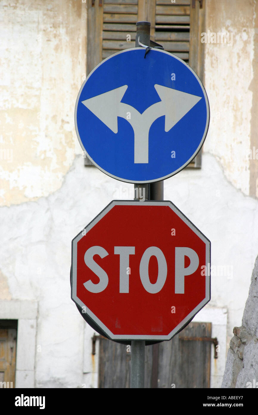 Stop sign and directional markers Stock Photo - Alamy
