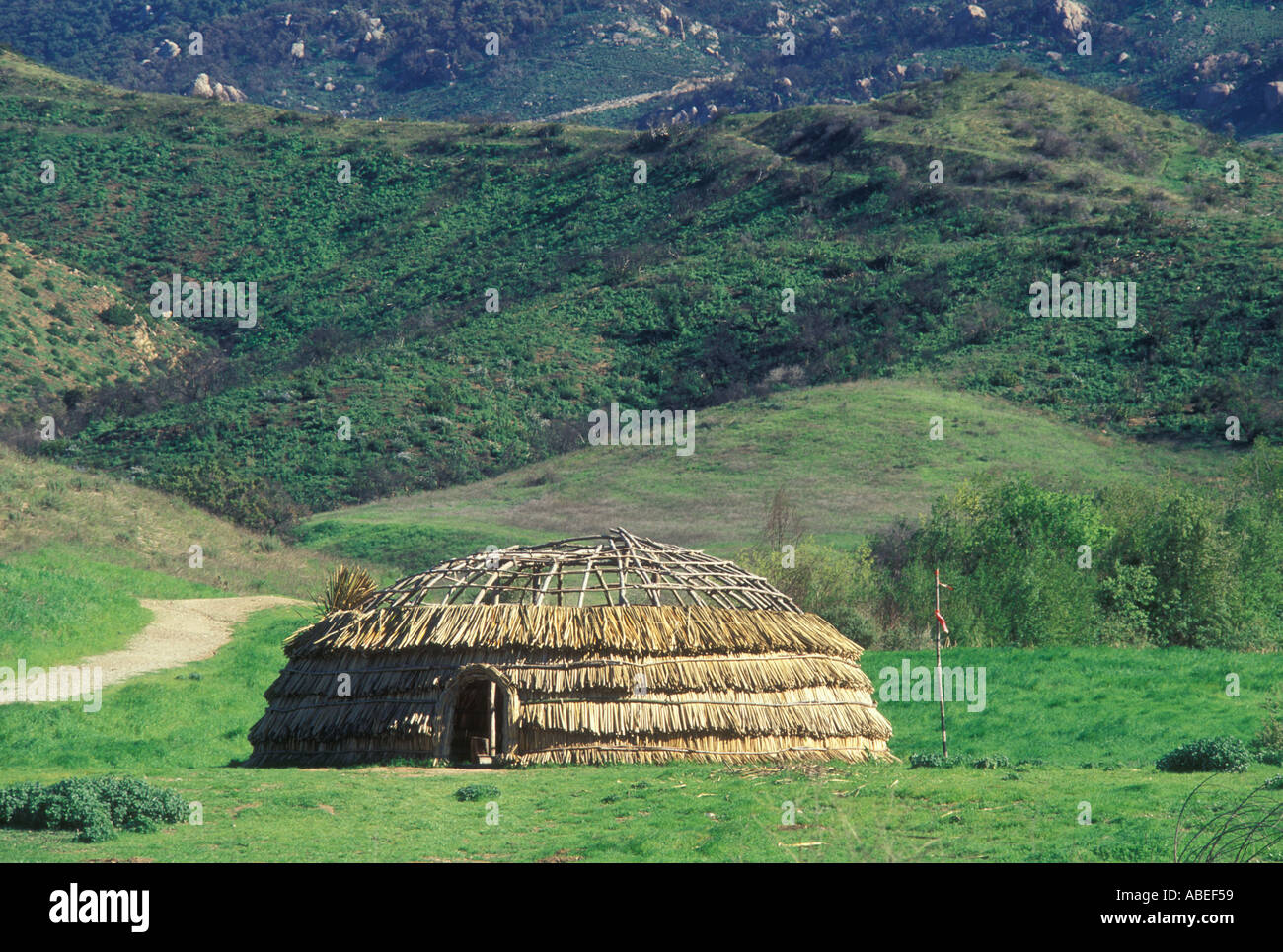 Rolling Hills Thatched Hay Building Stock Photo - Alamy