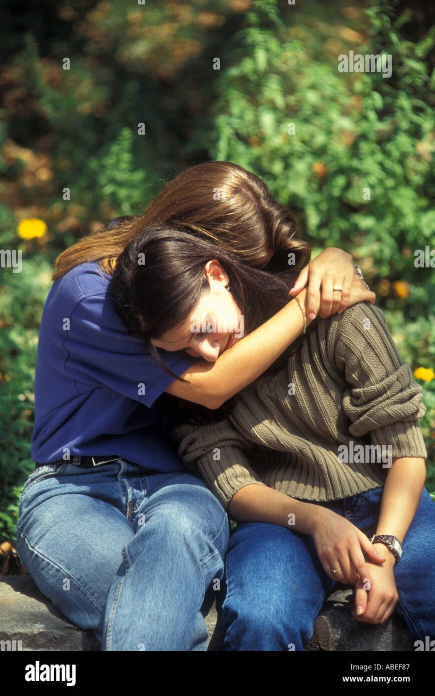 Teenage girl comforts her best friend Stock Photo - Alamy
